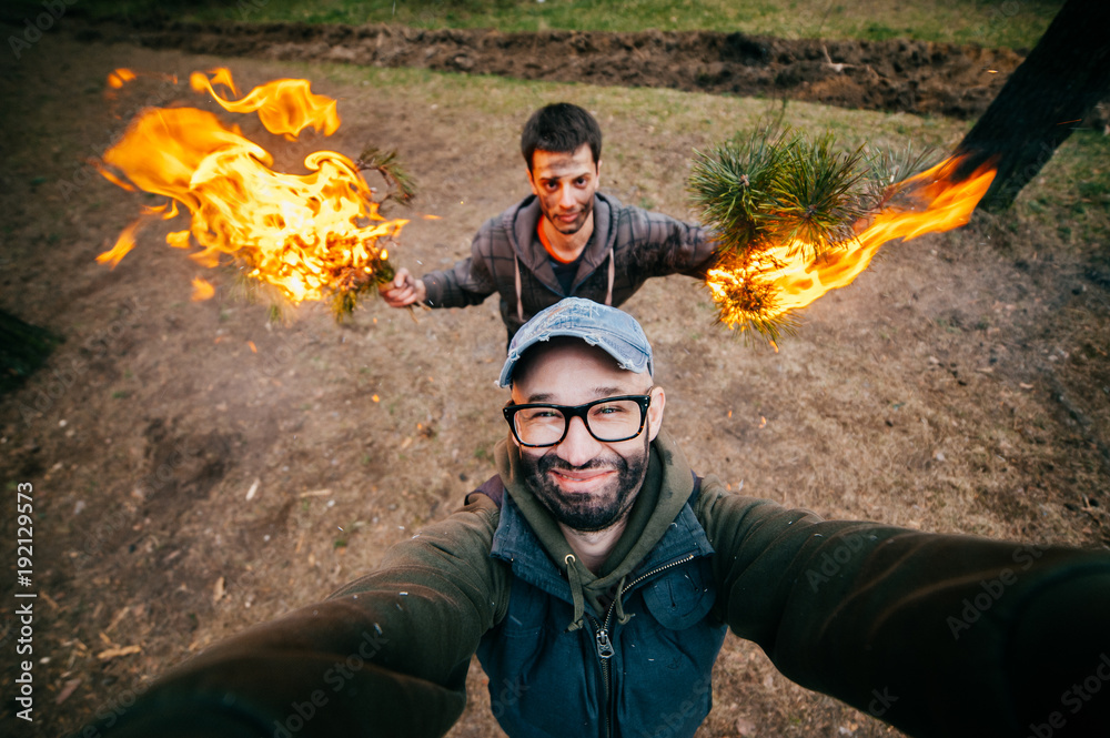 Frineds make selfie. Crazy funny boys mess around. Men at nature ...