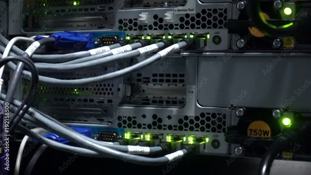 Working Ethernet switch in data center room, connecting computers ...
