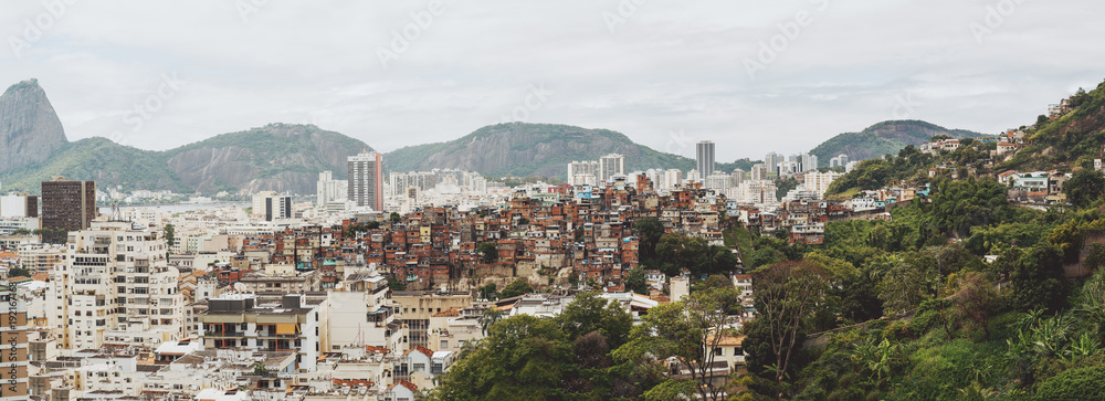 Panoramic image of Rio de Janeiro favelas district surrounded by hills ...