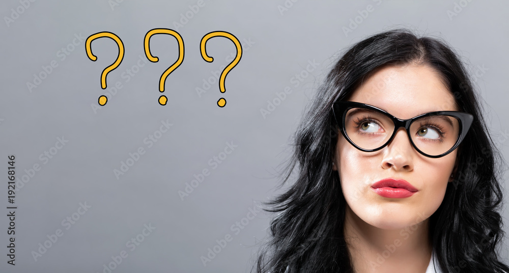 Question Marks with young businesswoman in a thoughtful face Stock ...