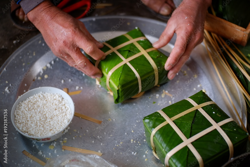 Packing Banh Chung (sticky rice cake), this is a traditional Vietnamese ...