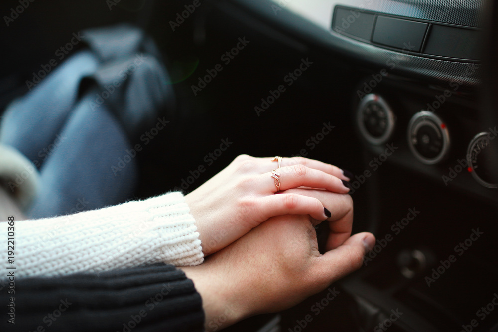 Couple Holding Hands In The Car