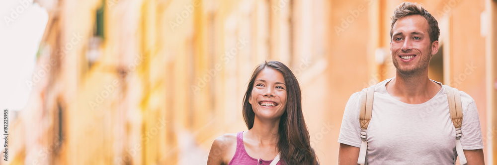 Young multiracial student couple smiling walking in Europe Rome, Italy ...