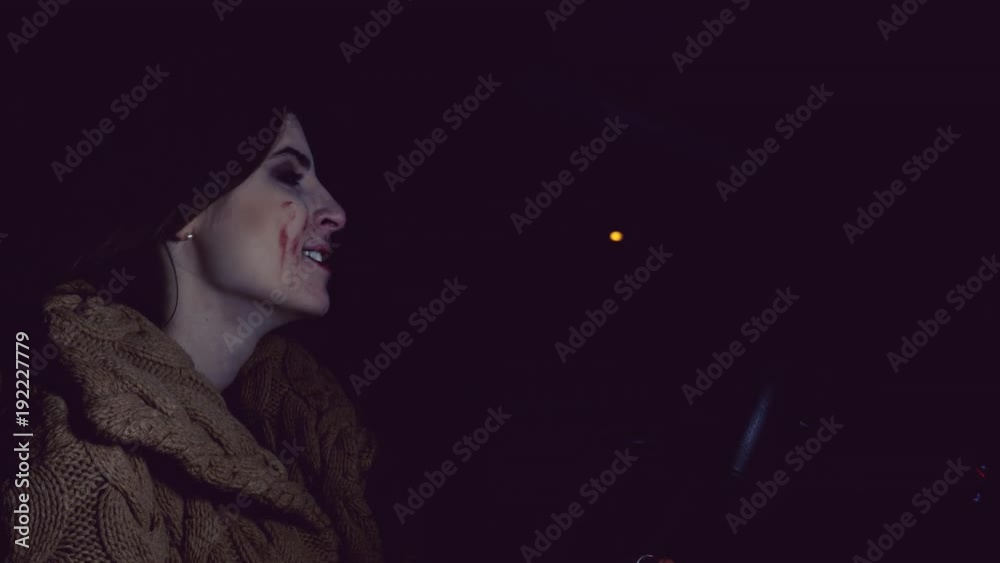 Female vampire driving car full of blood after killing Stock Video ...