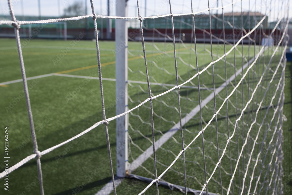 Red de portería en campo de fútbol Stock Photo | Adobe Stock