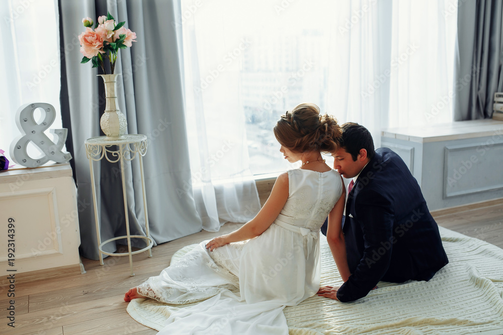 Groom and bride posing and smiling in studio for wedding shot. Wedding ...