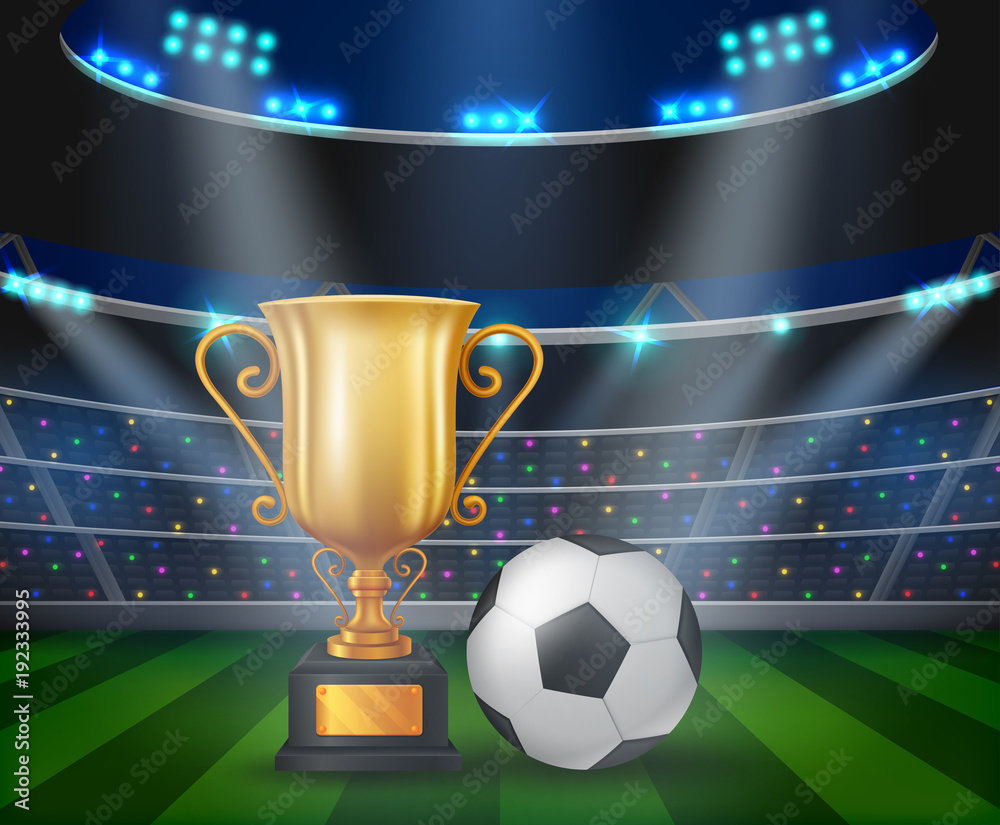 trophy and soccer ball on the podium with a football stadium background ...