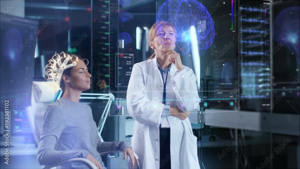 Stockvideon Woman Wearing Brainwave Scanning Headset Sits in a Chair ...