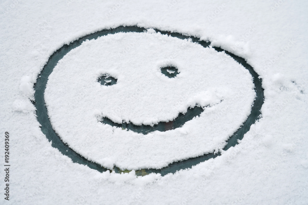 Smile face on the snow in winter after snow Photos | Adobe Stock
