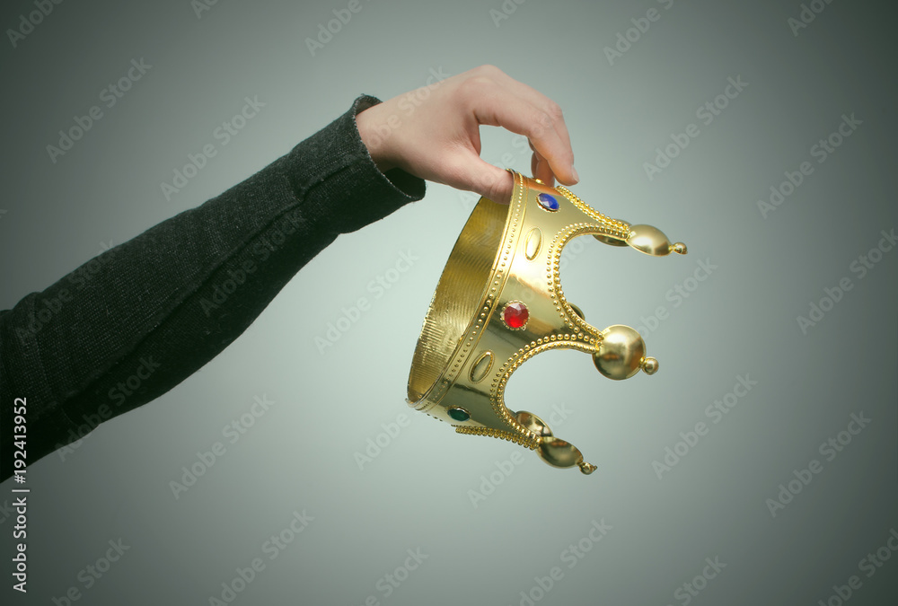 Male hand throws out the crown. Abandonment of power. Resign. Loss of ...