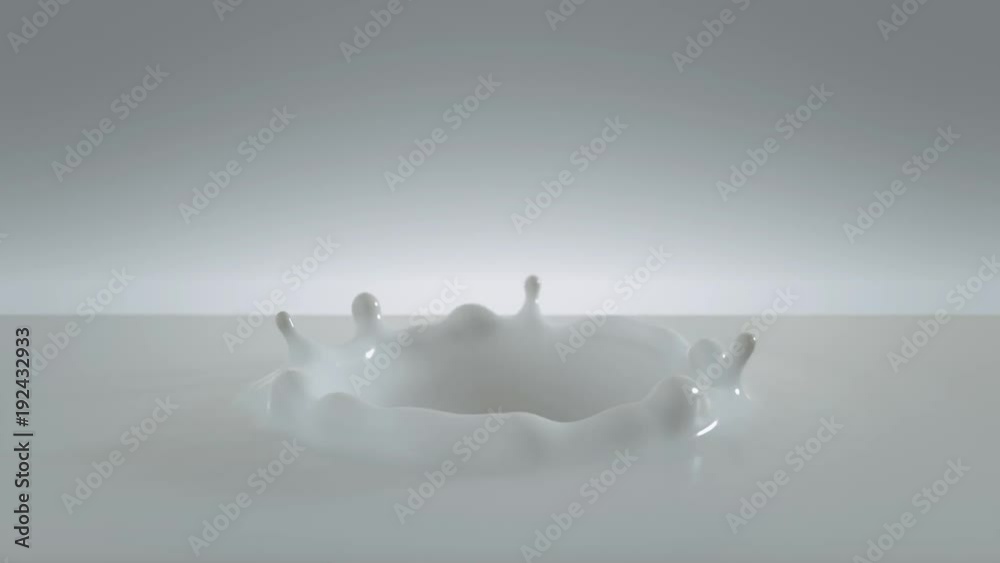 4k Slow-motion milk dropping and splashing forming a beautiful crown ...