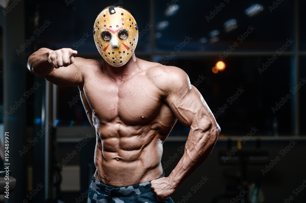 Brutal strong bodybuilder athletic men pumping up muscles with ...