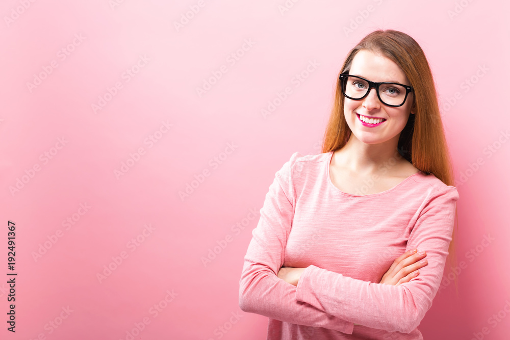 Happy young woman on a solid background Stock Photo | Adobe Stock