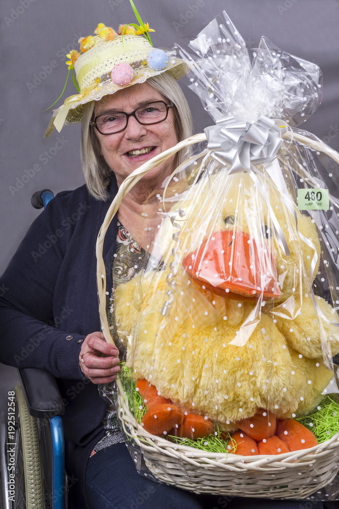 Easter Raffle Winner. Disabled lady in a wheelchair wearing an Easter ...