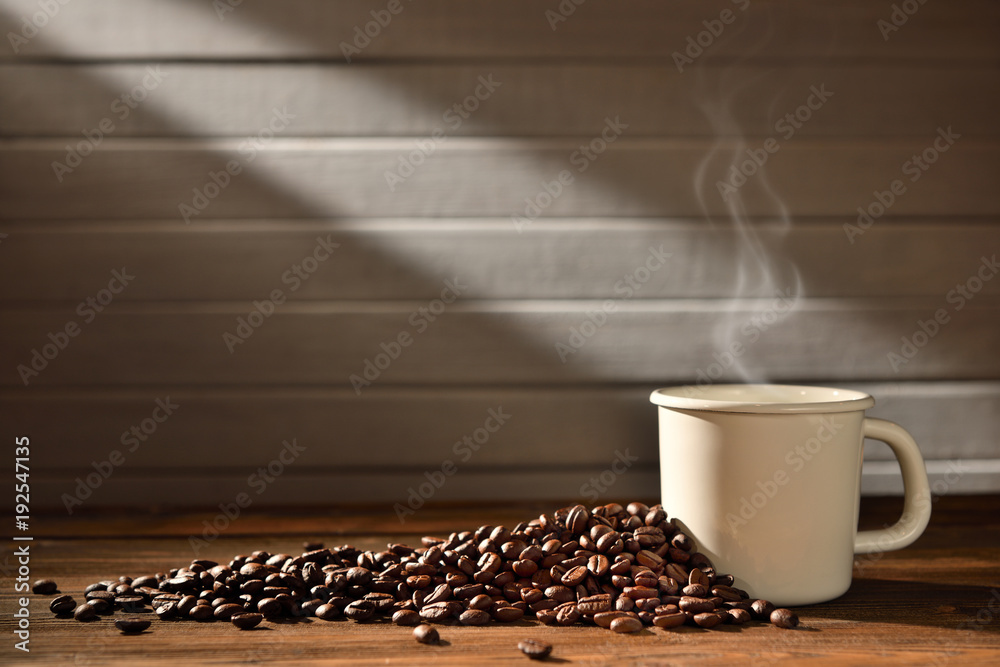Cup of coffee with smoke and coffee beans on wooden background, This ...