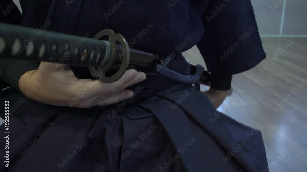 Close-up, Hands of the Samurai Sitting on the Floor and Tuck in the ...