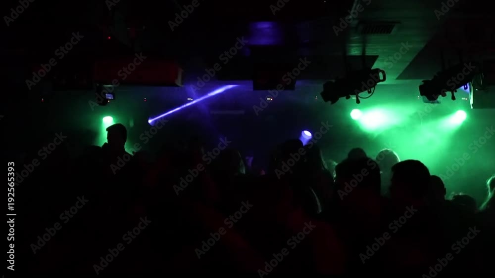 Party and dj show in the night club on the green lights background ...
