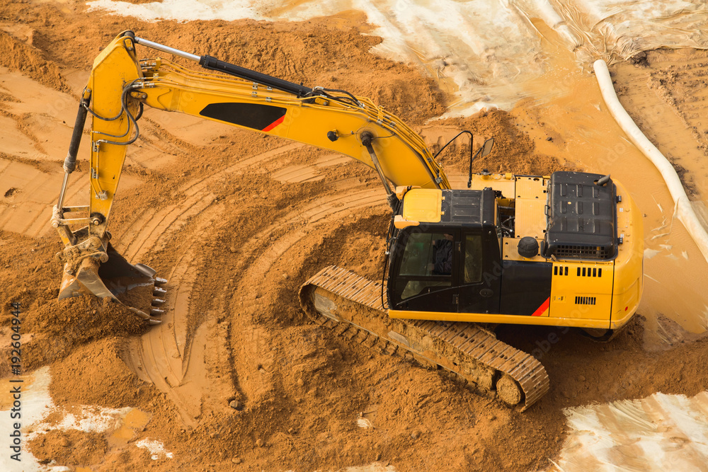 Working Excavator Tractor Digging A Trench. Stock Photo | Adobe Stock