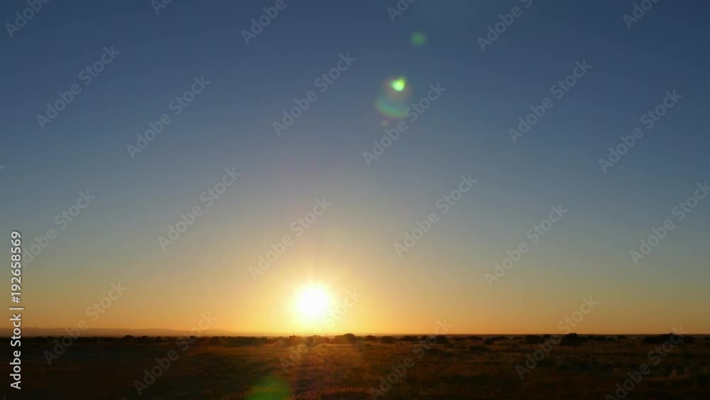 Colorful sunrise timelapse over an open landscape. Versatile background ...