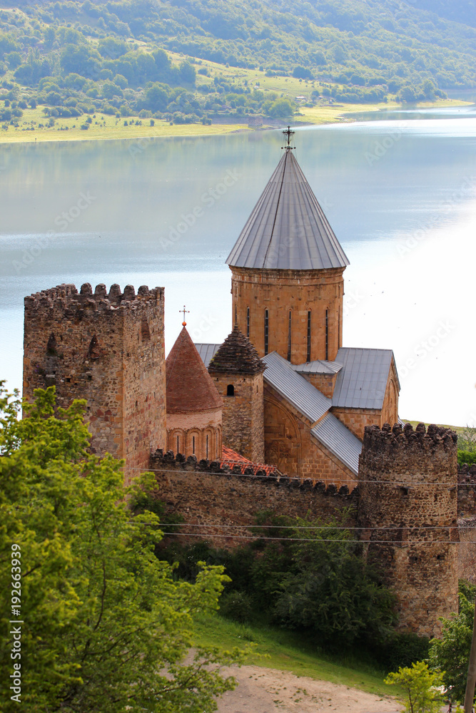 Medieval castle complex with church on Jinvali water reservoir, Aragvi ...