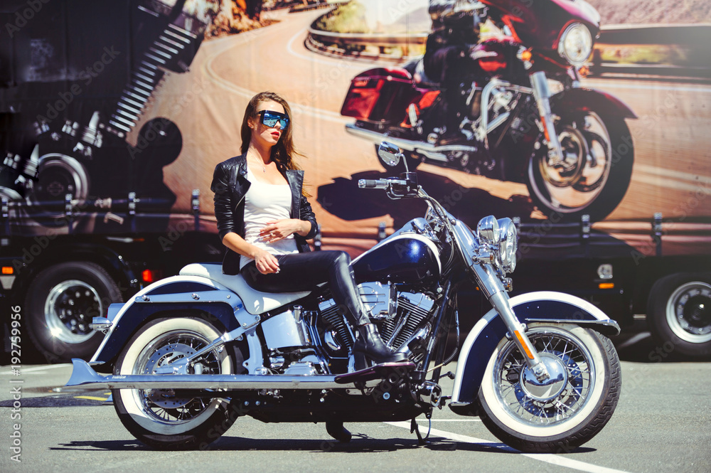 beautiful fashionable woman on a classic motorcycle, model appearance ...