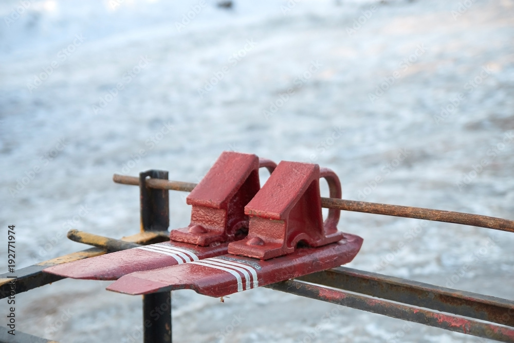 railway brake shoes of red color lie on the rack. railway skid. railway ...