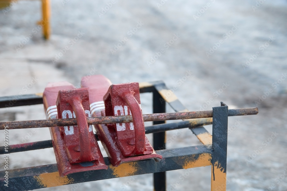 railway brake shoes of red color lie on the rack. railway skid. railway ...