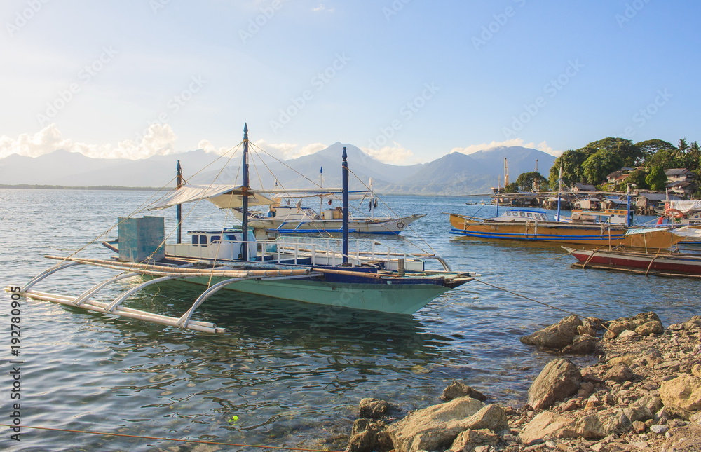Traditional Philippine boats on the beach in Puerto Princesa. The ...