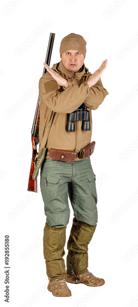 Full length portrait of a male hunter with stop gesture Isolated on ...