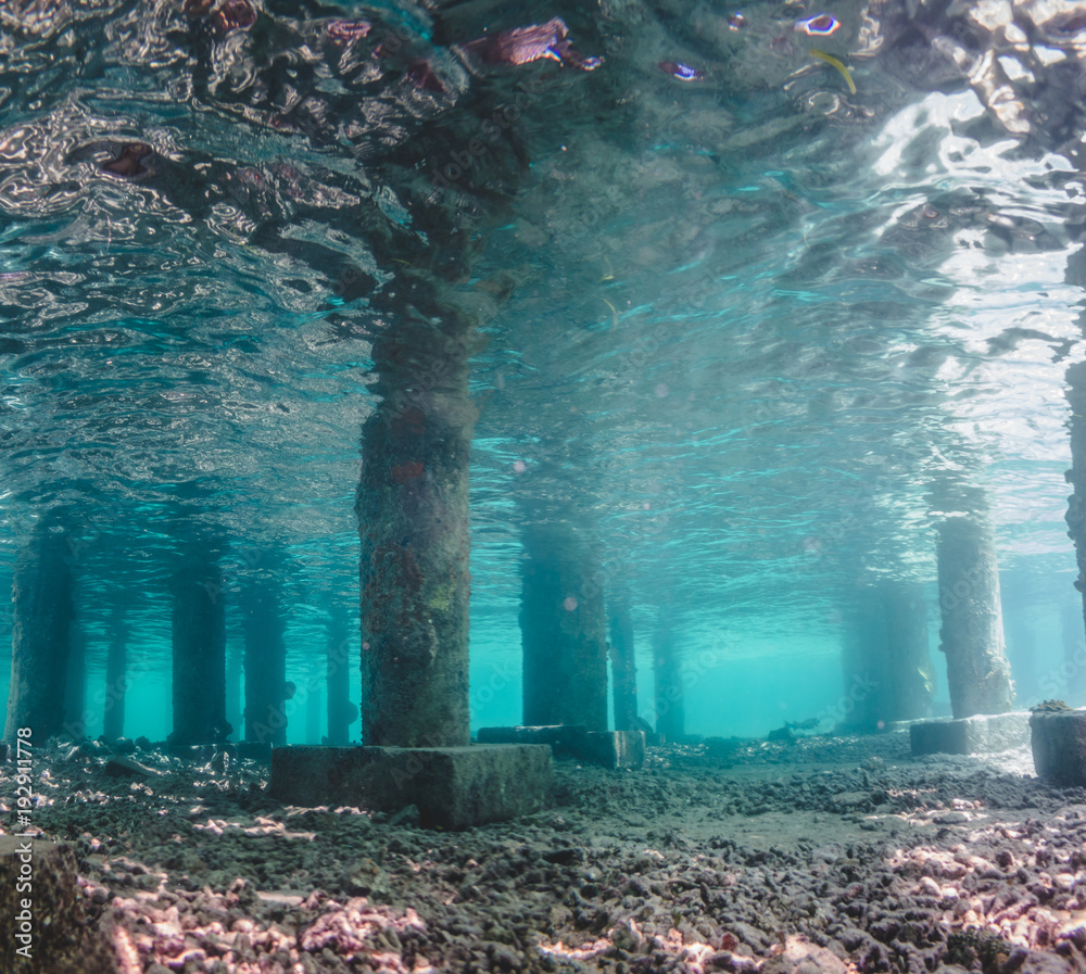 Underwater view of Under a Pier with Pillars and Sun Light Stock Photo ...