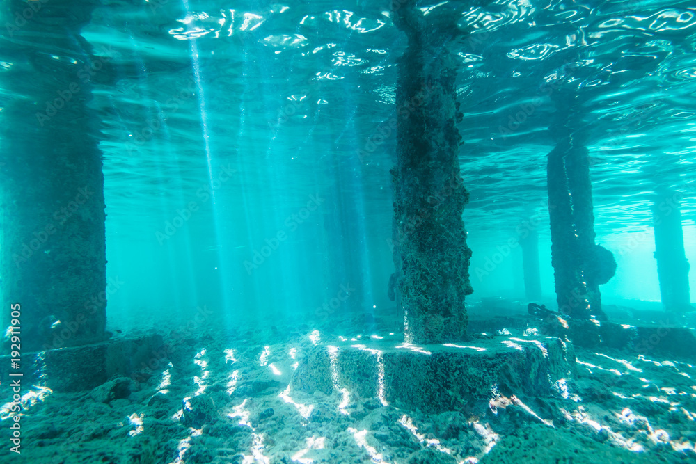 Underwater view of Under a Pier with Pillars and Sun Light Stock Photo ...