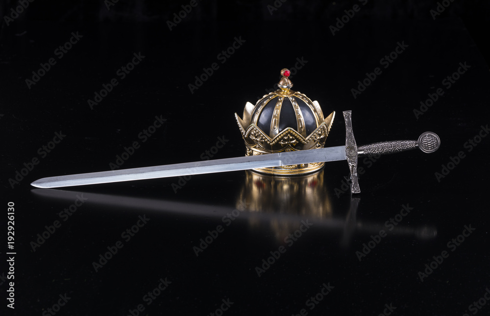 Medieval sword and crown on a black isolated background Stock Photo ...