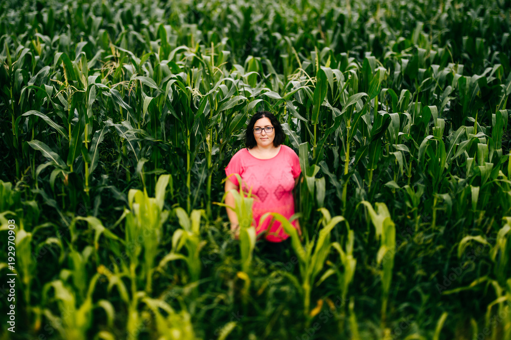 Strange unusual woman portrait in cucumber field. Female hiding her ...