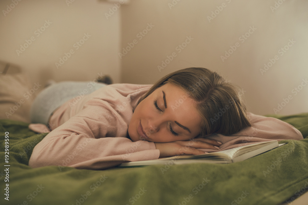 Beautiful woman fall asleep while reading a book. Stock Photo | Adobe Stock