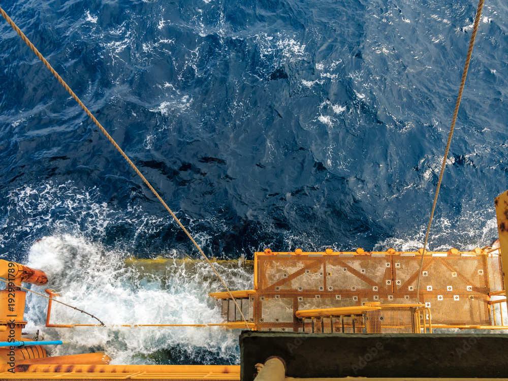 Offshore oil and gas platform at boat landing while the high wave in ...