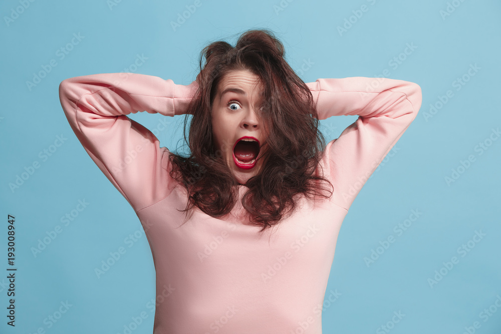 The squint eyed woman with weird expression isolated on blue Stock-Foto ...