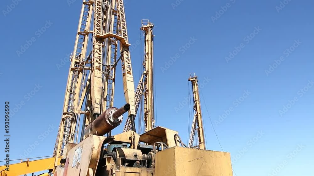 Drilling machines towers. Towers of drilling machines are standing tall ...