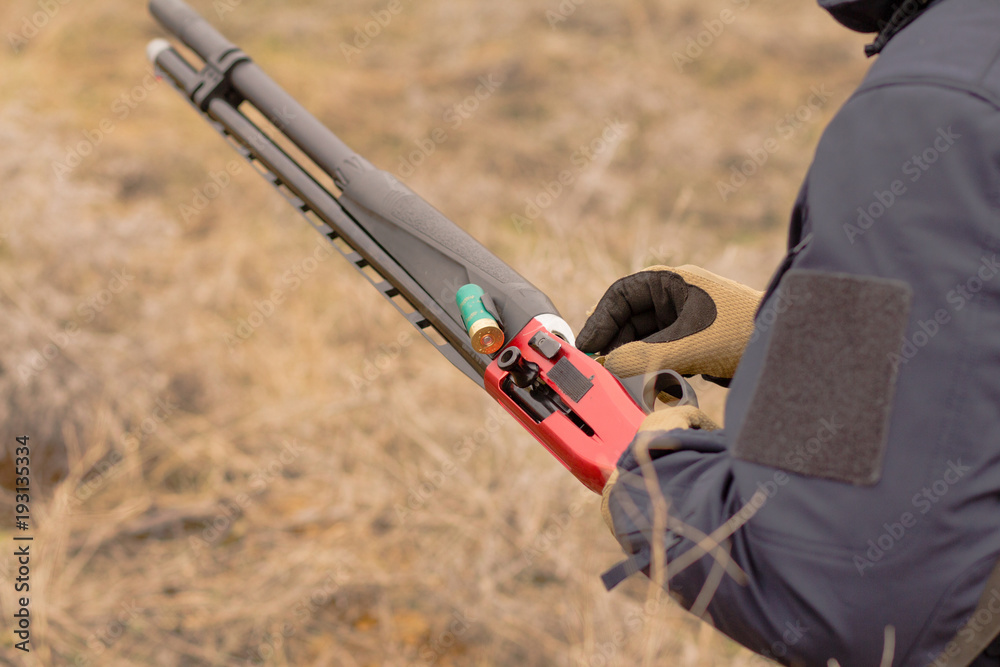 Close up picture of pump action shotgun reloading Stock Photo | Adobe Stock