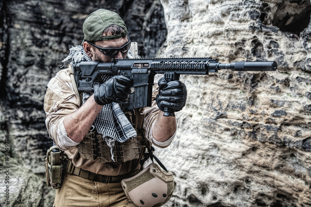 Private military contractor PMC in baseball cap with assault rifle in ...