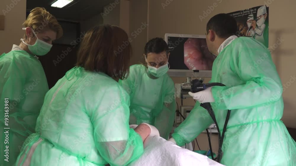 Vídeo do Stock: Medical team examining colon of patient who lying on ...