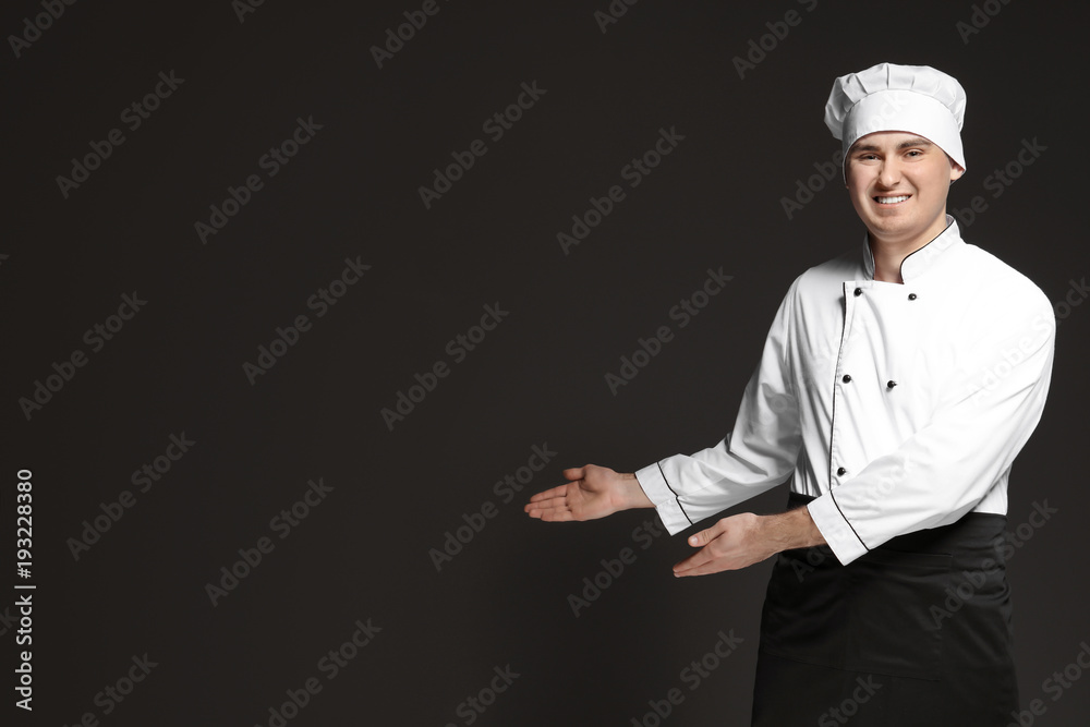 Male chef in uniform on dark background Stock Photo | Adobe Stock