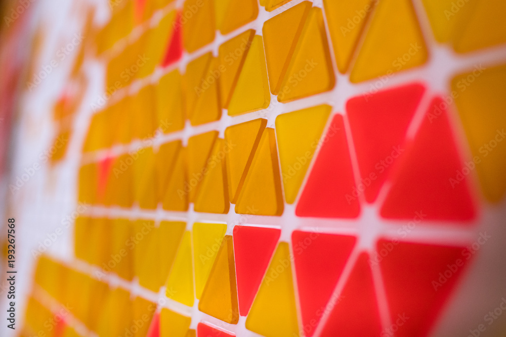 tessellation of a plane with yellow, orange and red colored triangles ...
