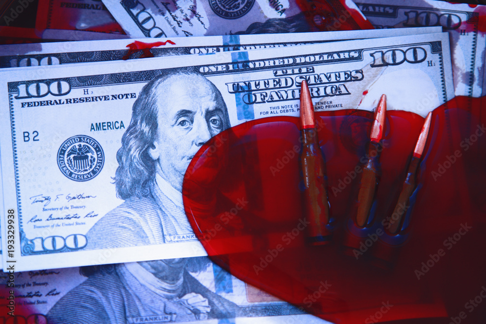 Contract killing and murder for money concept. Bullets on dollar bills ...