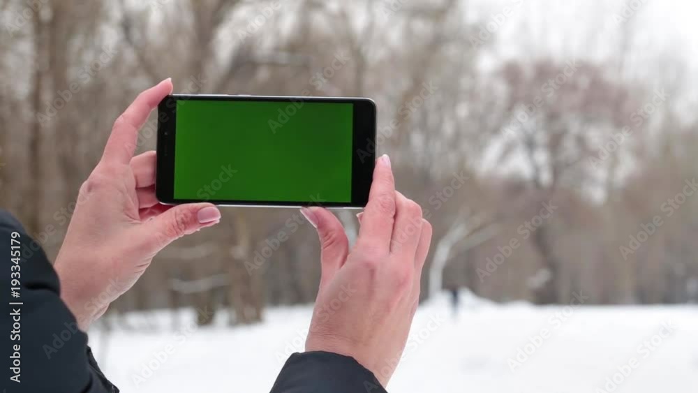 Video Stock Mockup video of black mobile telephone in two female hands ...