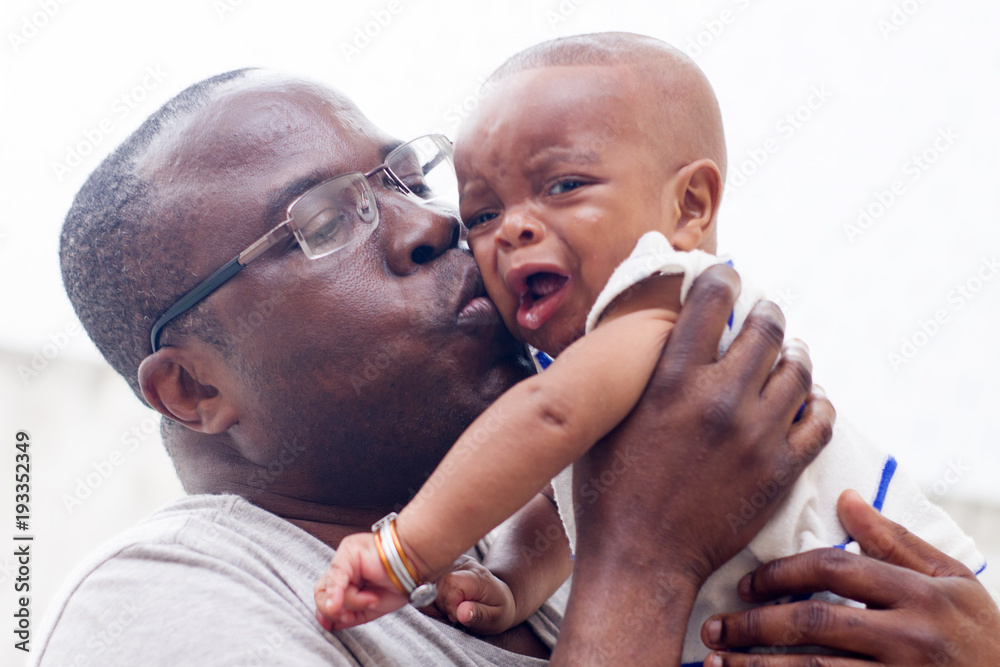 portrait of a young man and his baby. Photos | Adobe Stock
