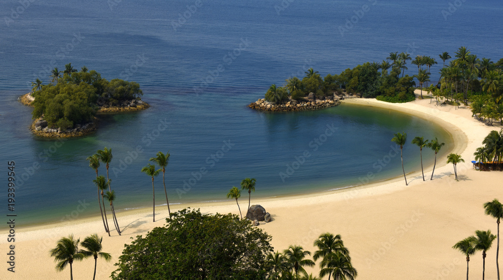 view to a small lagoon at Siloso beach on Sentosa island, Singapore ...