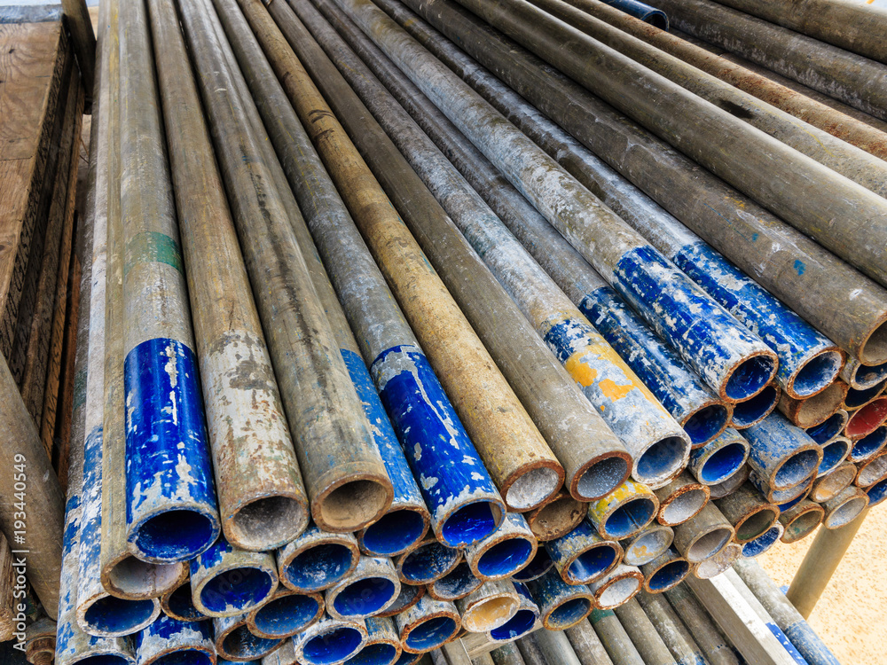 Mental scaffold pipe stack together on scaffold plank wood shelve with ...
