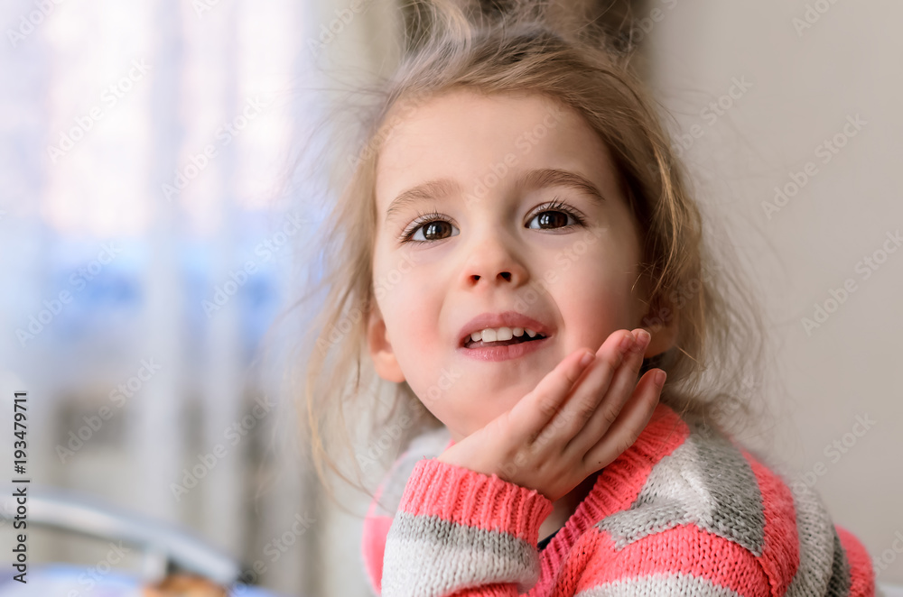 a pretty little girl with shiny brown eyes and long eyelashes, looks ...