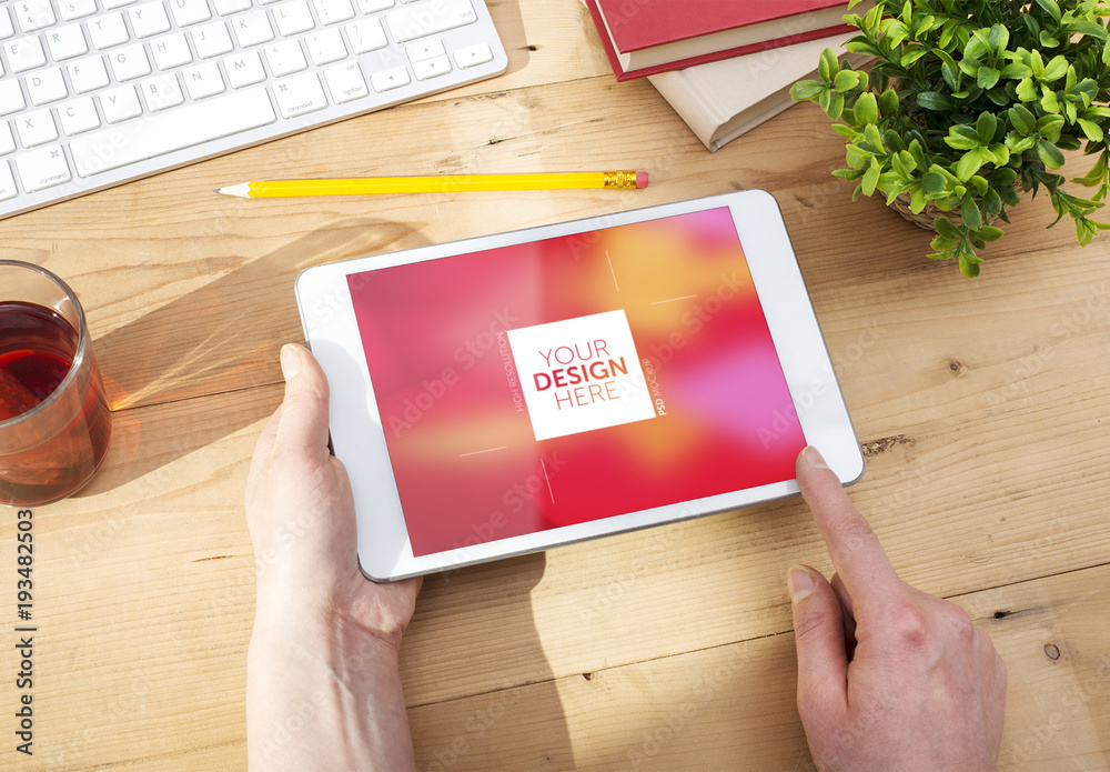 Mockup of Tablet User at Wooden Desk 2 Stock Template | Adobe Stock