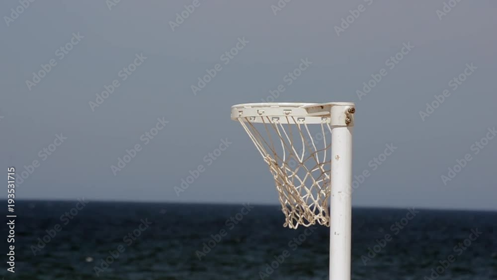A Close Up Shot of a Netball Hoop with the Net gracefully blowing in ...